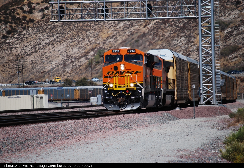 BNSF 7912 decends on Main 3 towards San Bernardino, Ca pulling a vehicle train.